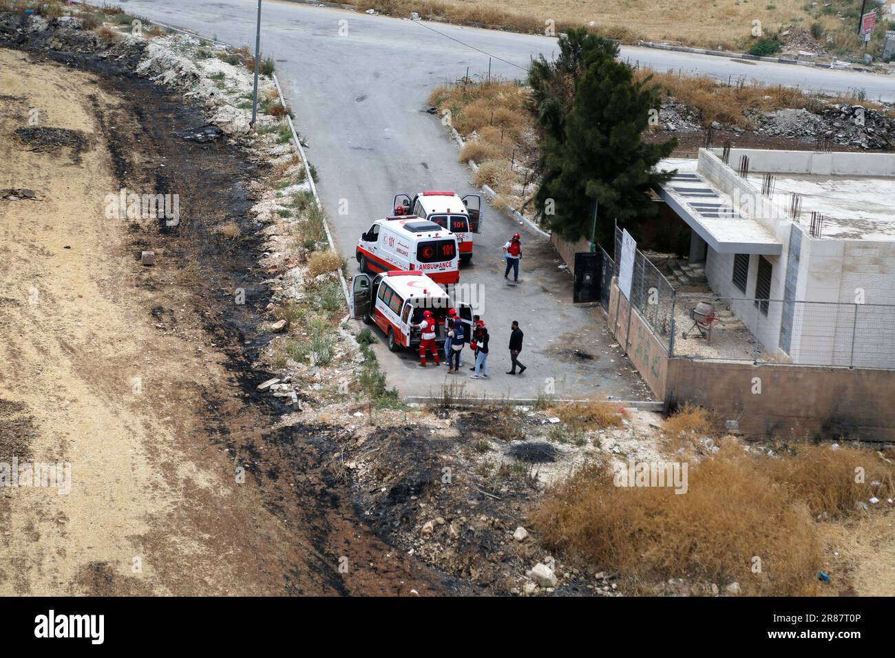 Palestinian paramedics seen transporting casualties during a raid on ...