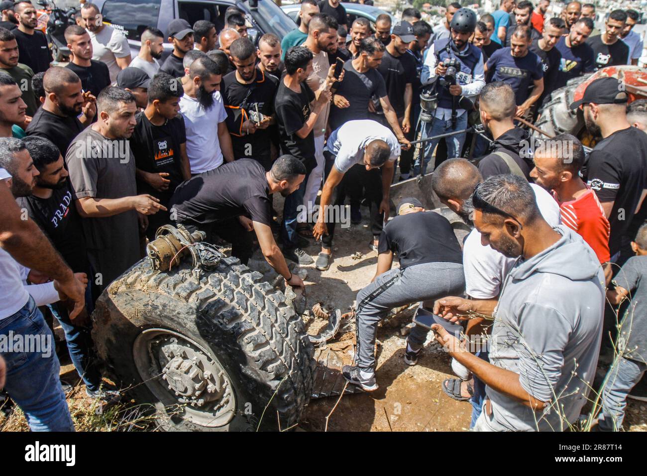 Jenin, Palestine. 19th June, 2023. Palestinians inspect the remains of ...