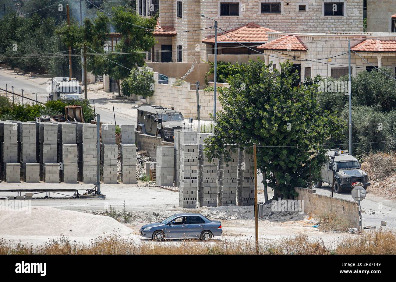 Israeli military vehicles surround a neighborhood of Jenin camp during ...