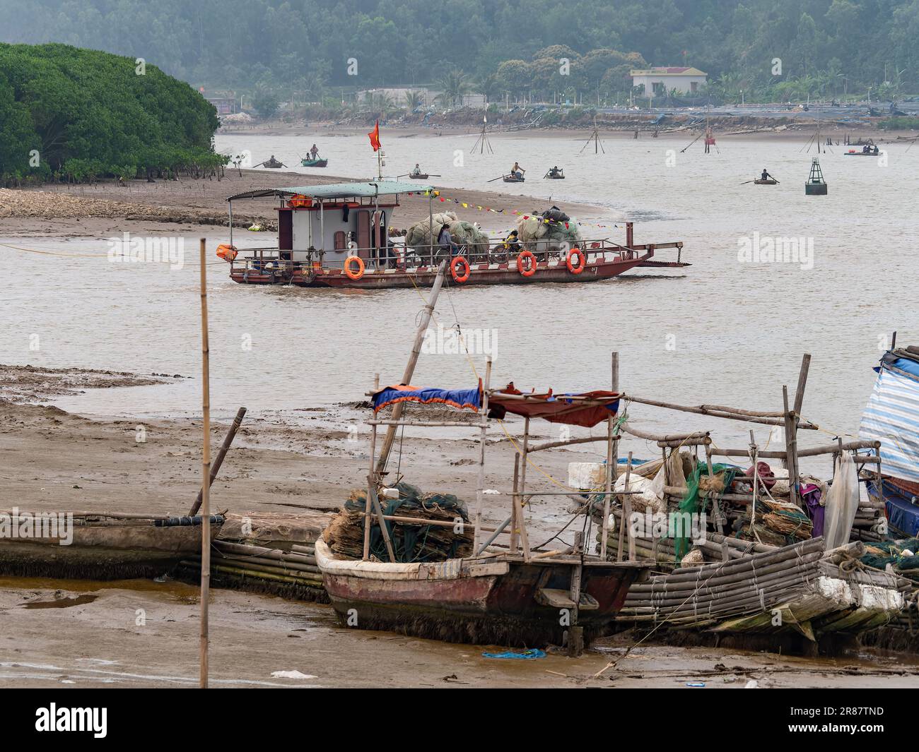Simple car ferry crossing a river in Thanh Hoa Province in Vietnam with ...