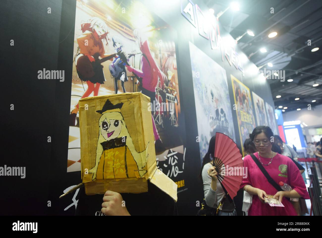 Visitors wear self-made cartoon character boxes during the 2023 China ...