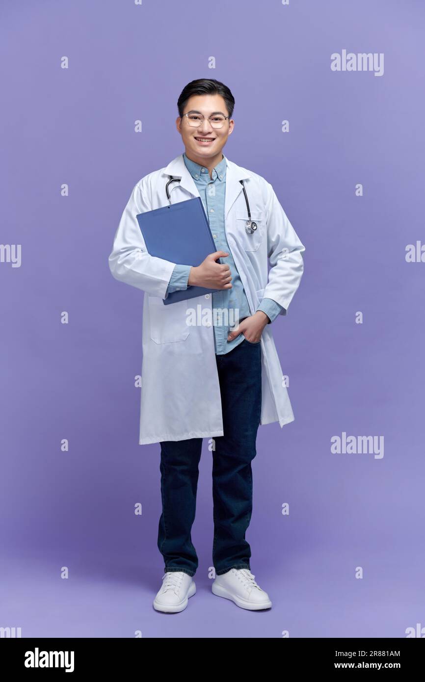 Male doctor standing folder on hi-res stock photography and images - Alamy