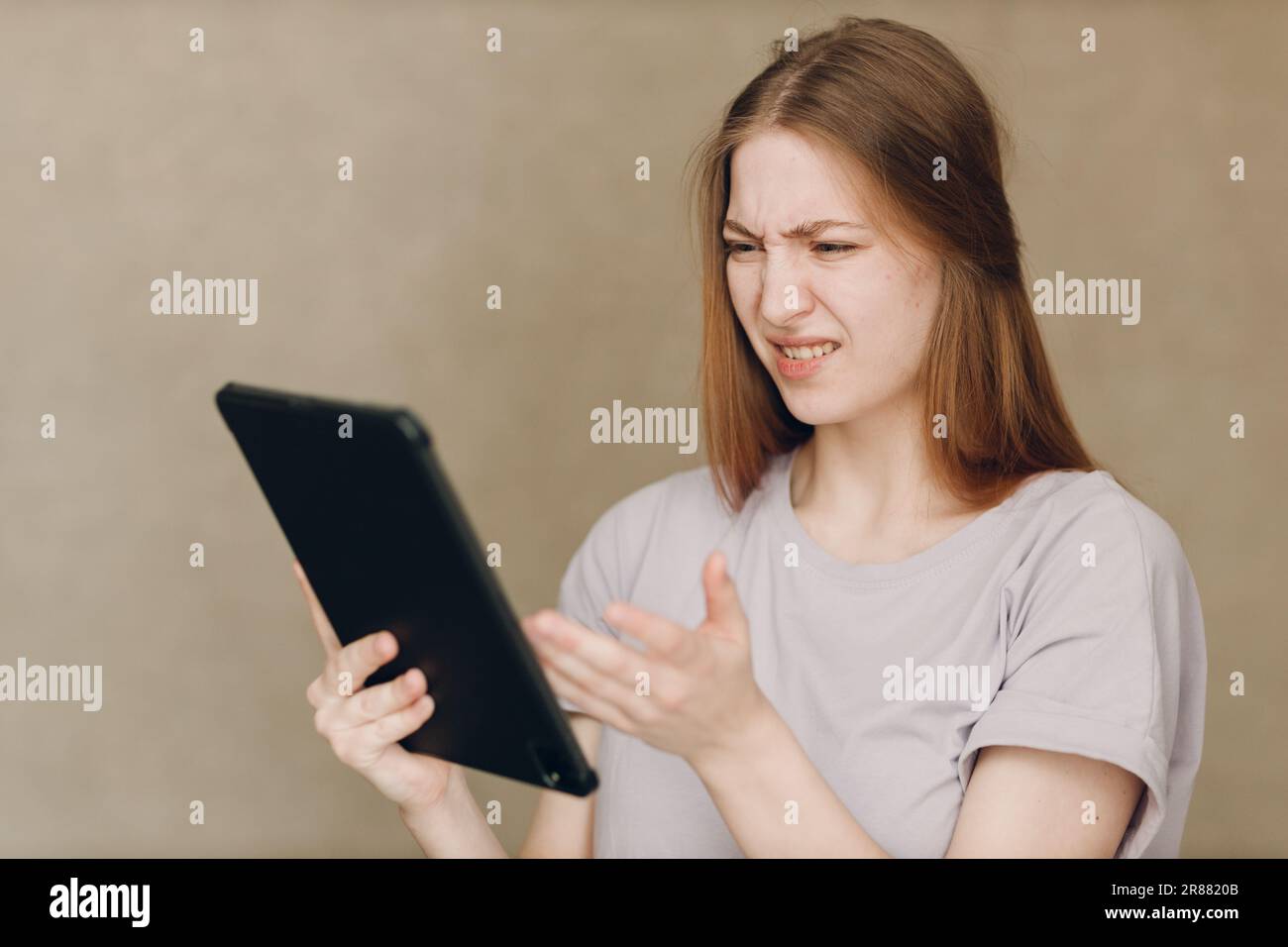 Portrait of young student actress learning role woman with digital ...