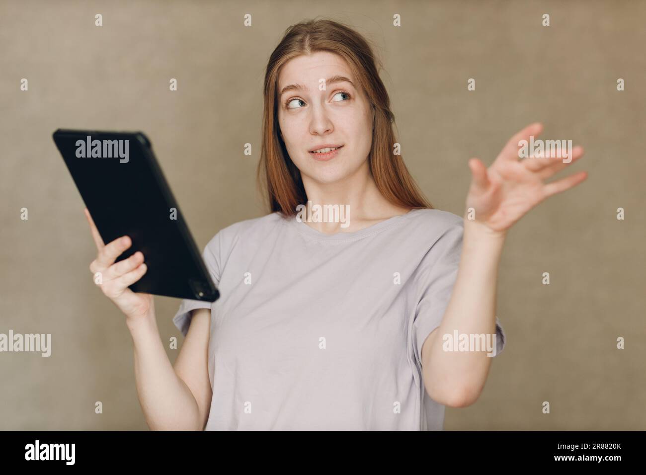 Portrait of young student actress learning role woman with digital ...