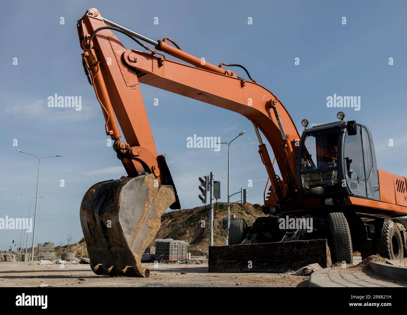 excavator blue sky heavy machine construction site. construction bucket ...