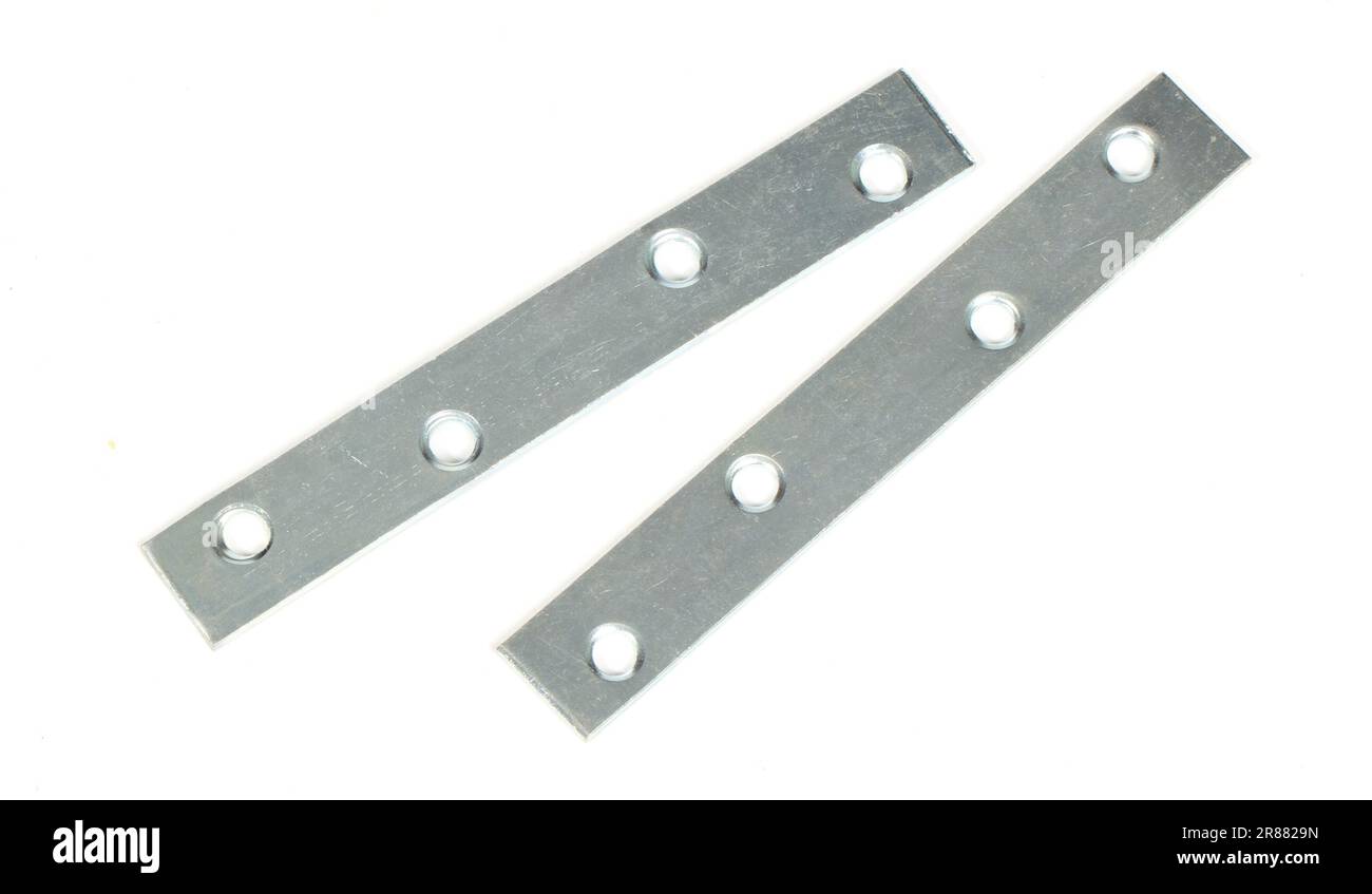 Small metal brackets, isolated on white background Stock Photo - Alamy