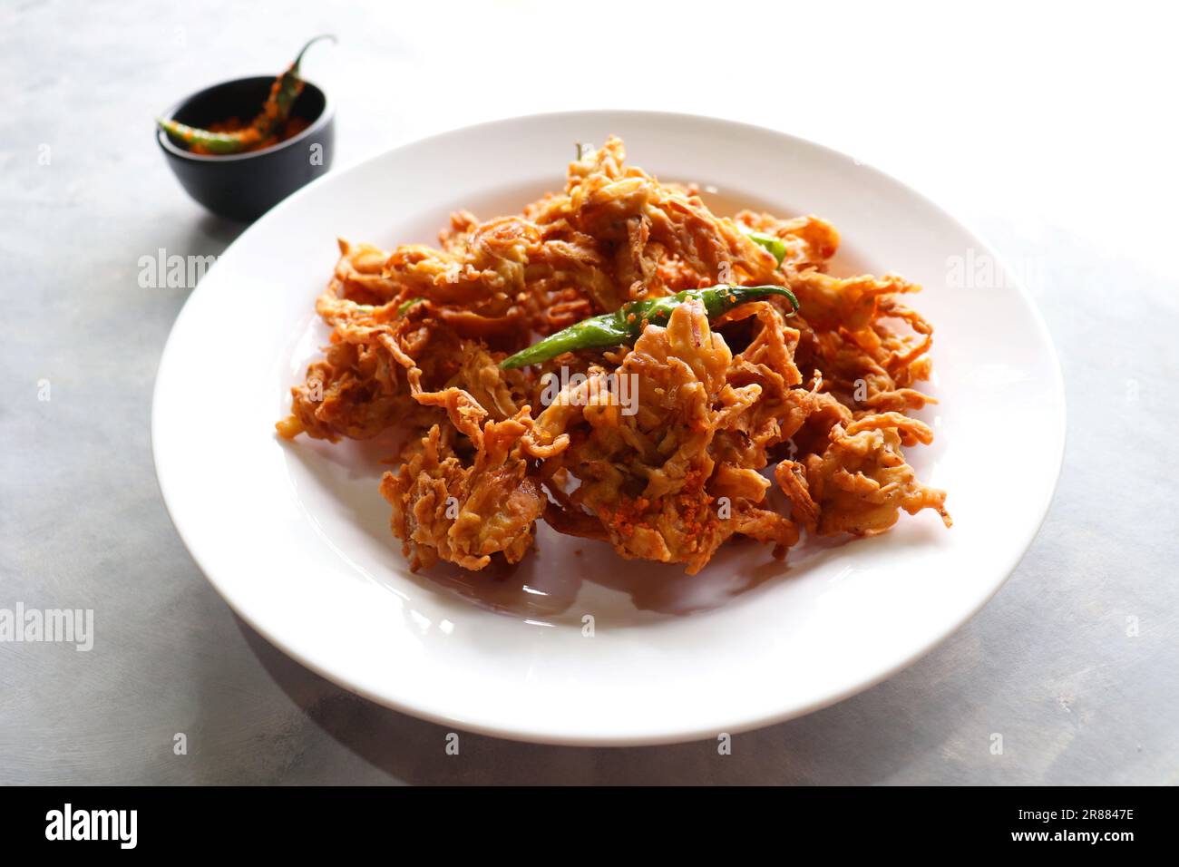 Fried onion pakode or Pyaj ke Pakore also known as Crispy Kanda bhaji ...