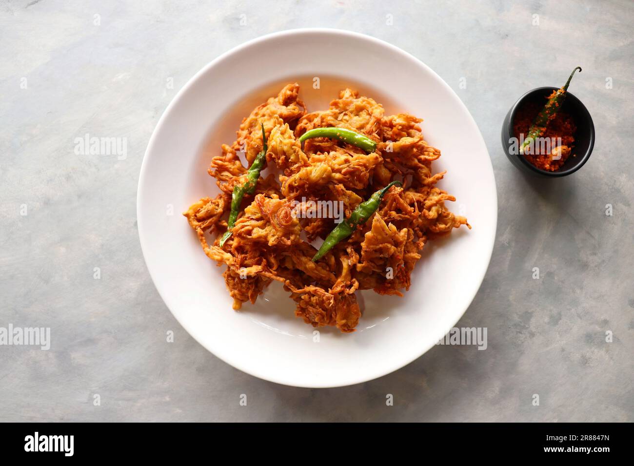 Fried onion pakode or Pyaj ke Pakore also known as Crispy Kanda bhaji ...