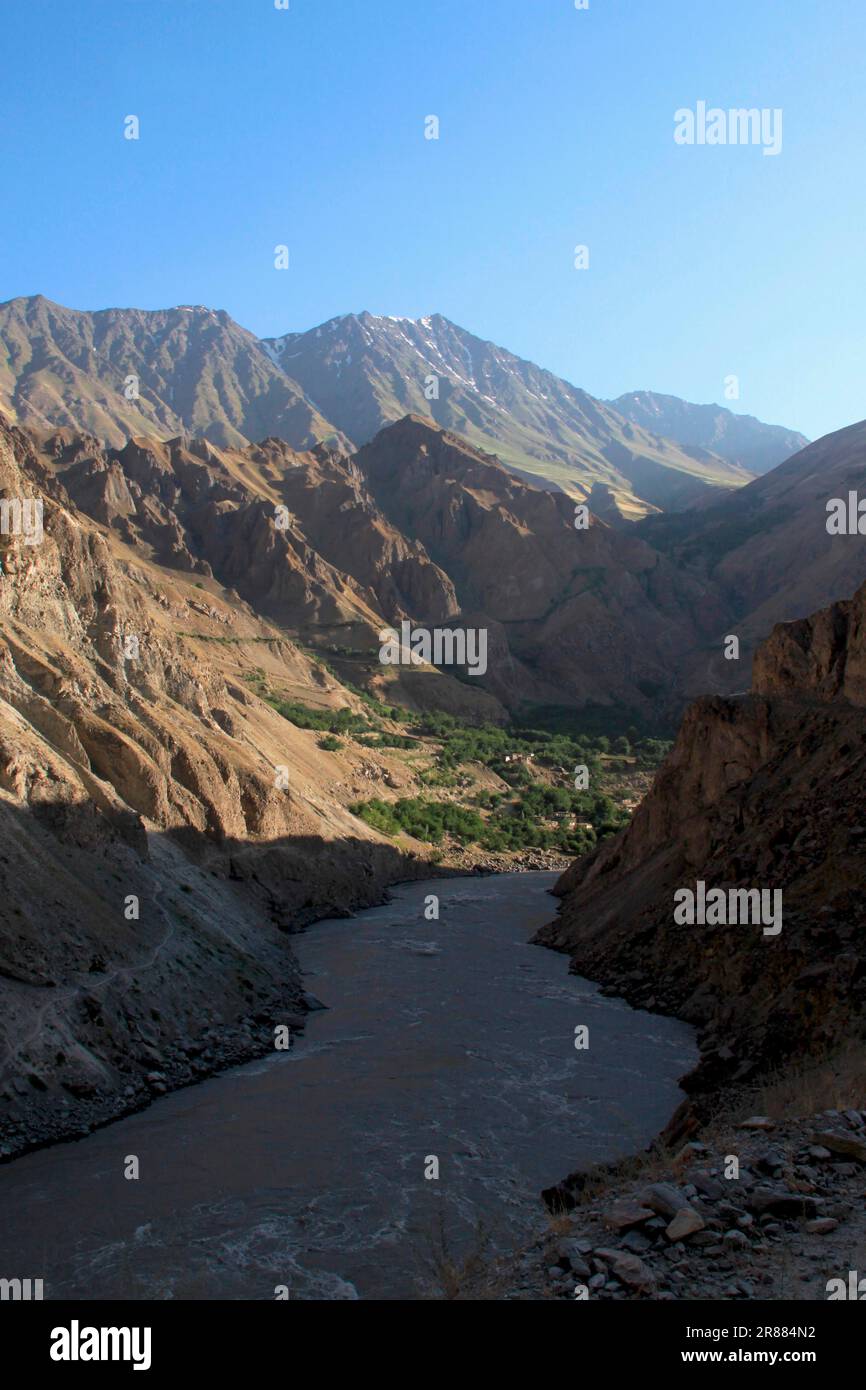 View from the Pamir Highway across the border river Pyanj to ...
