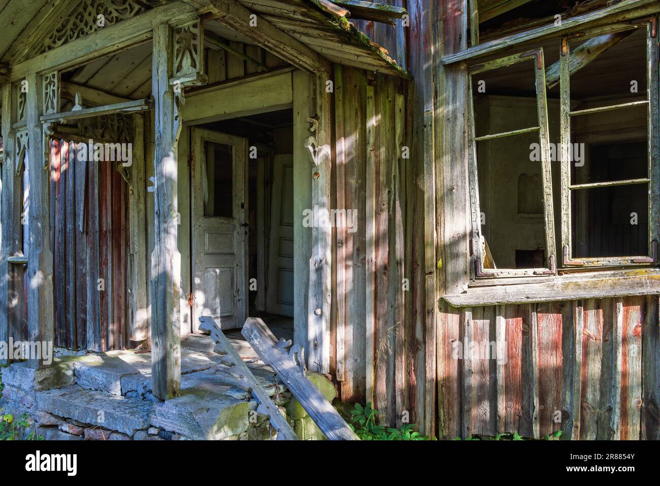 Old abandoned wooden cottage with carpentry, Sweden Stock Photo - Alamy