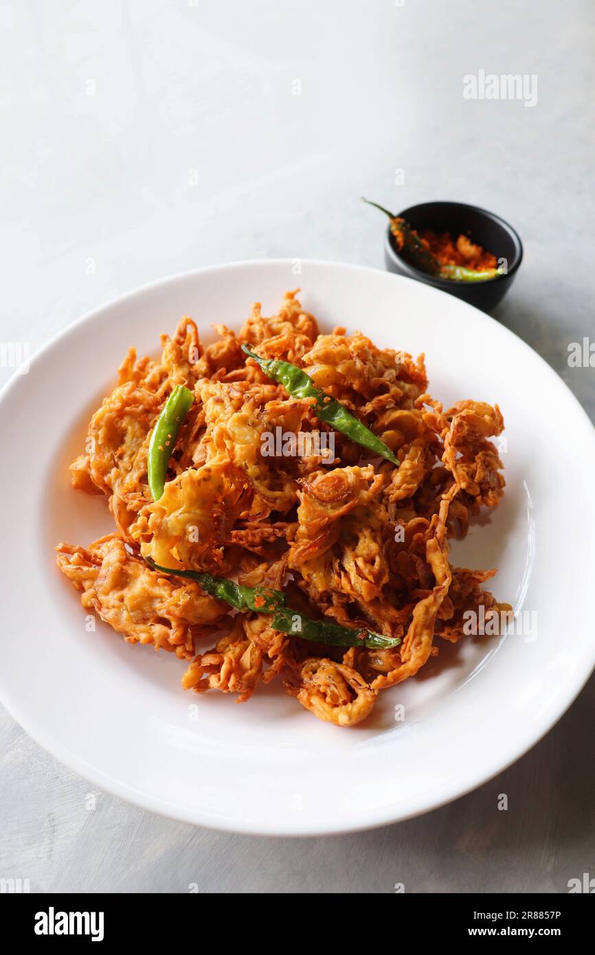Fried onion pakode or Pyaj ke Pakore also known as Crispy Kanda bhaji ...