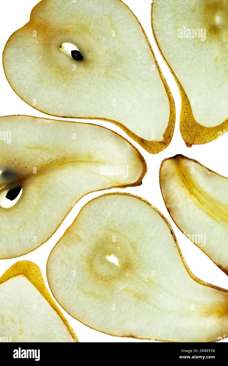 Sliced pear against white background Studio shot Stock Photo - Alamy