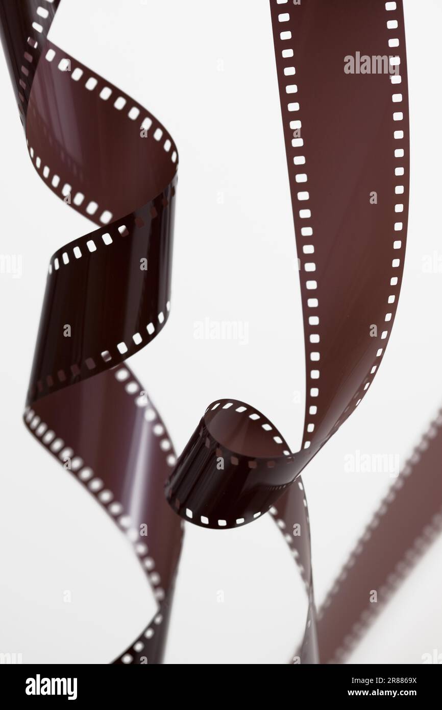 Old camera film strip against a white background Stock Photo - Alamy