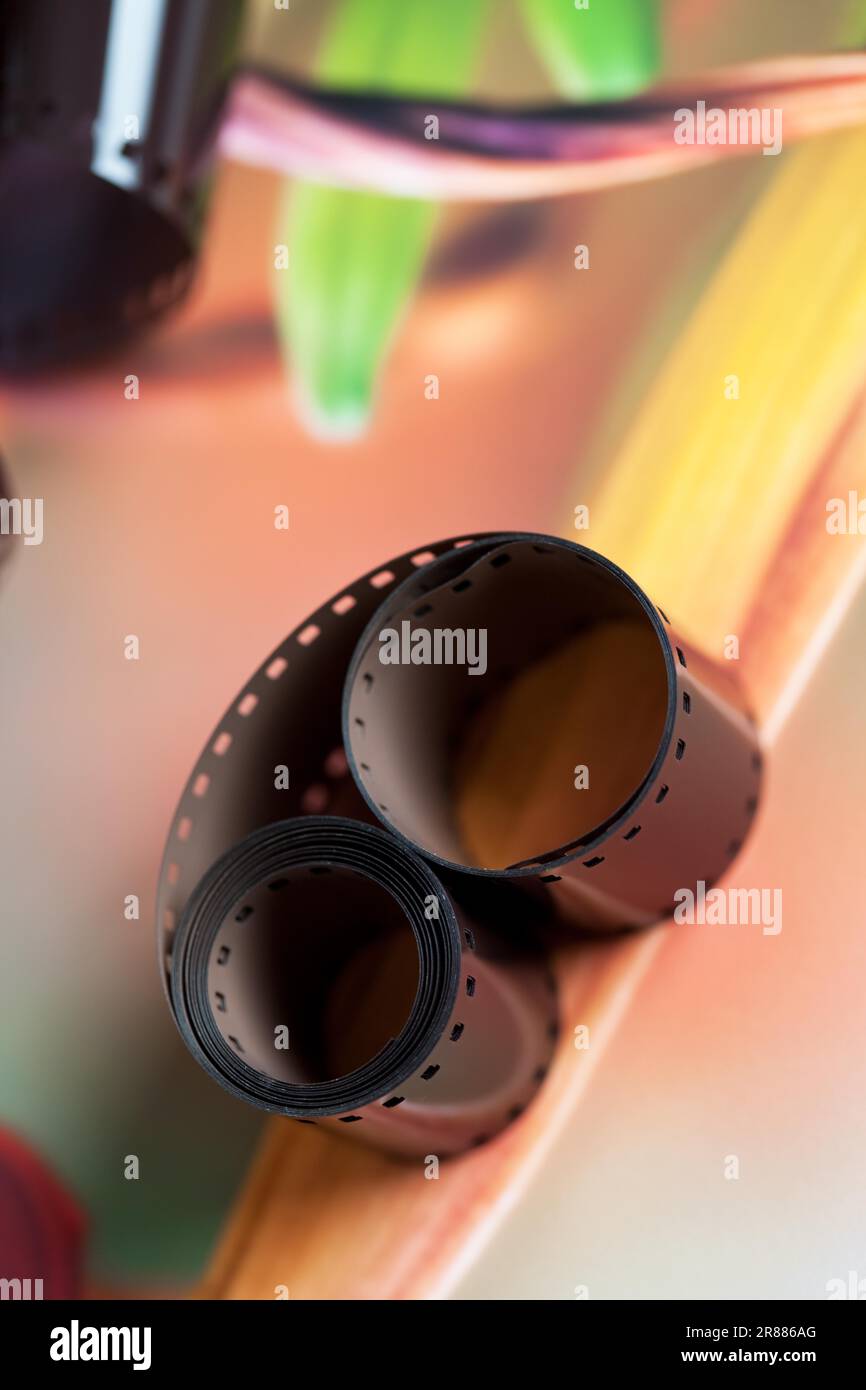 Old camera film strip with photo background Stock Photo - Alamy