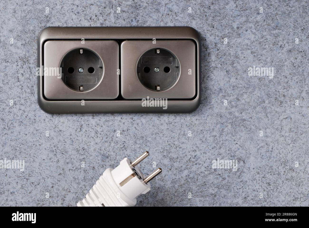 White plug and a power socket Stock Photo - Alamy