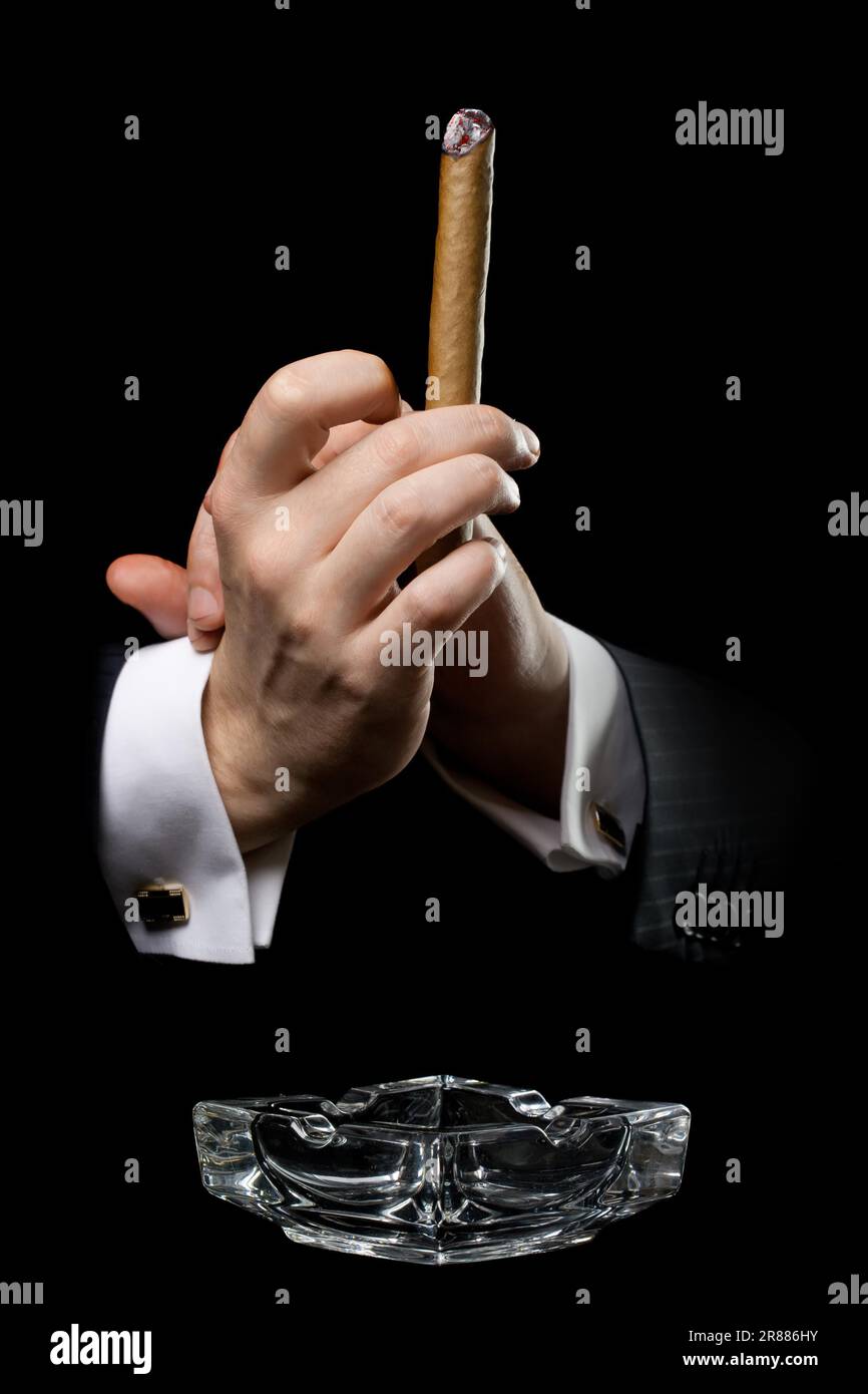cigar smoking over black Stock Photo - Alamy