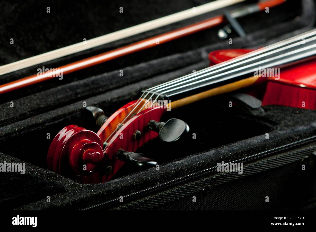 Beautiful violin and bow in black velvet case Stock Photo - Alamy