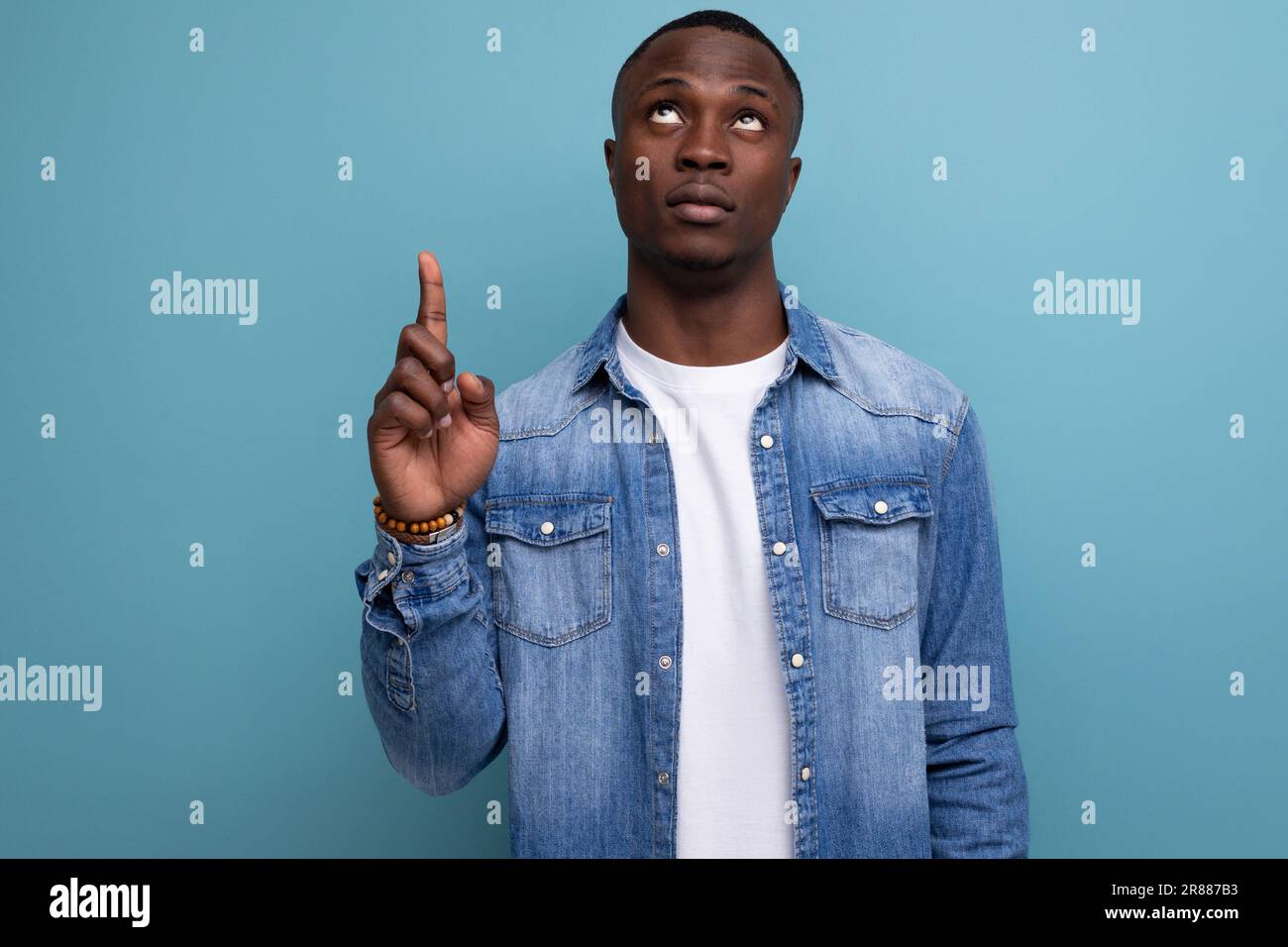 handsome young attractive african man dressed casually in denim clothes ...