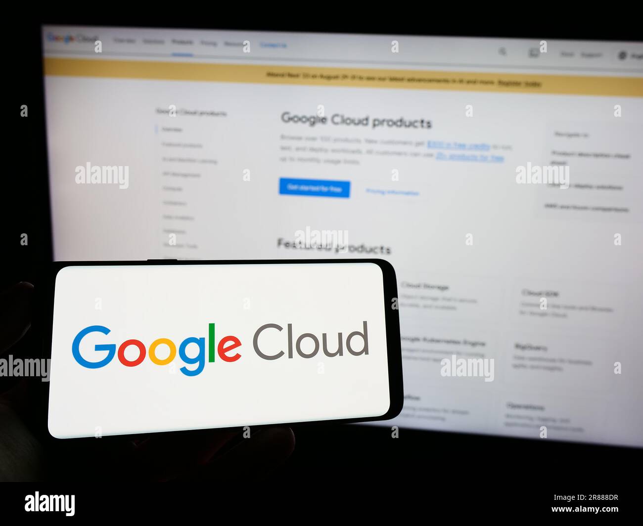 Person holding mobile phone with logo of computing services Google ...