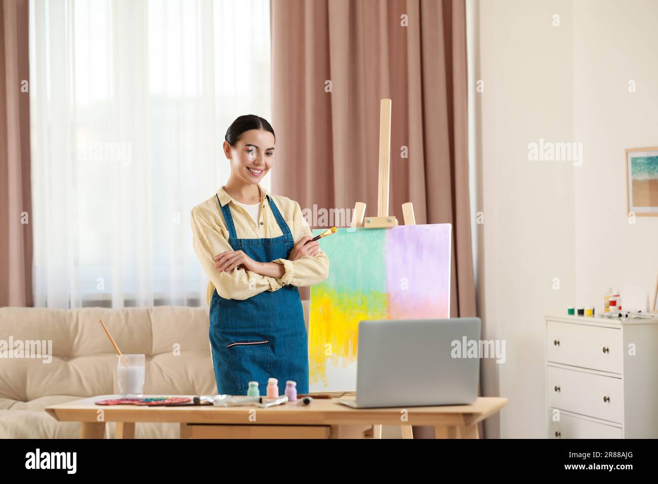 Teacher conducting online painting lesson at home. Time for hobby Stock ...