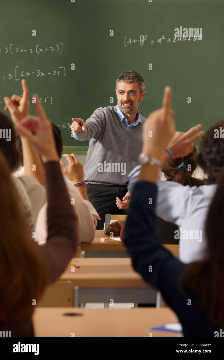 Math teacher giving lessons. Classroom with students. School education ...