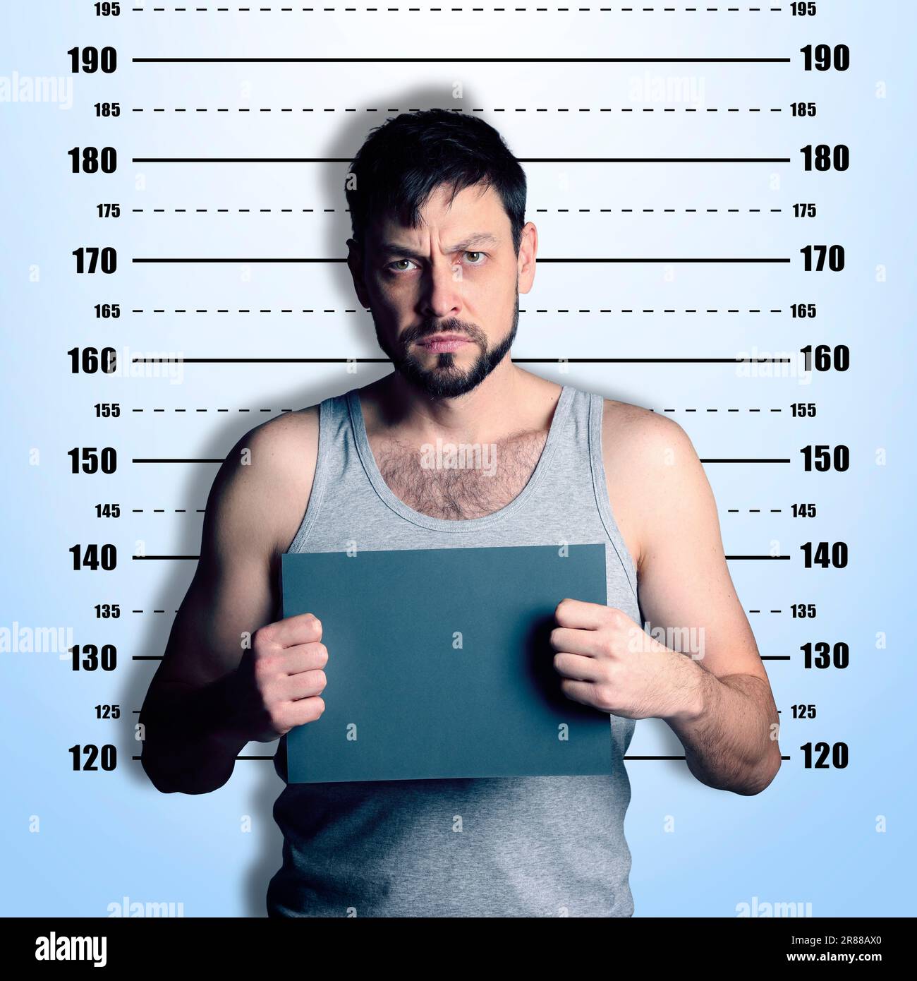 Criminal mugshot. Arrested man with blank card against height chart ...