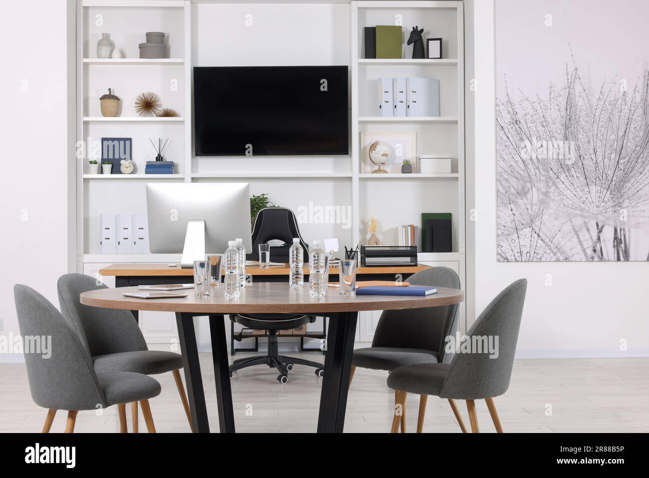 Stylish office with comfortable furniture and tv zone. Interior design ...