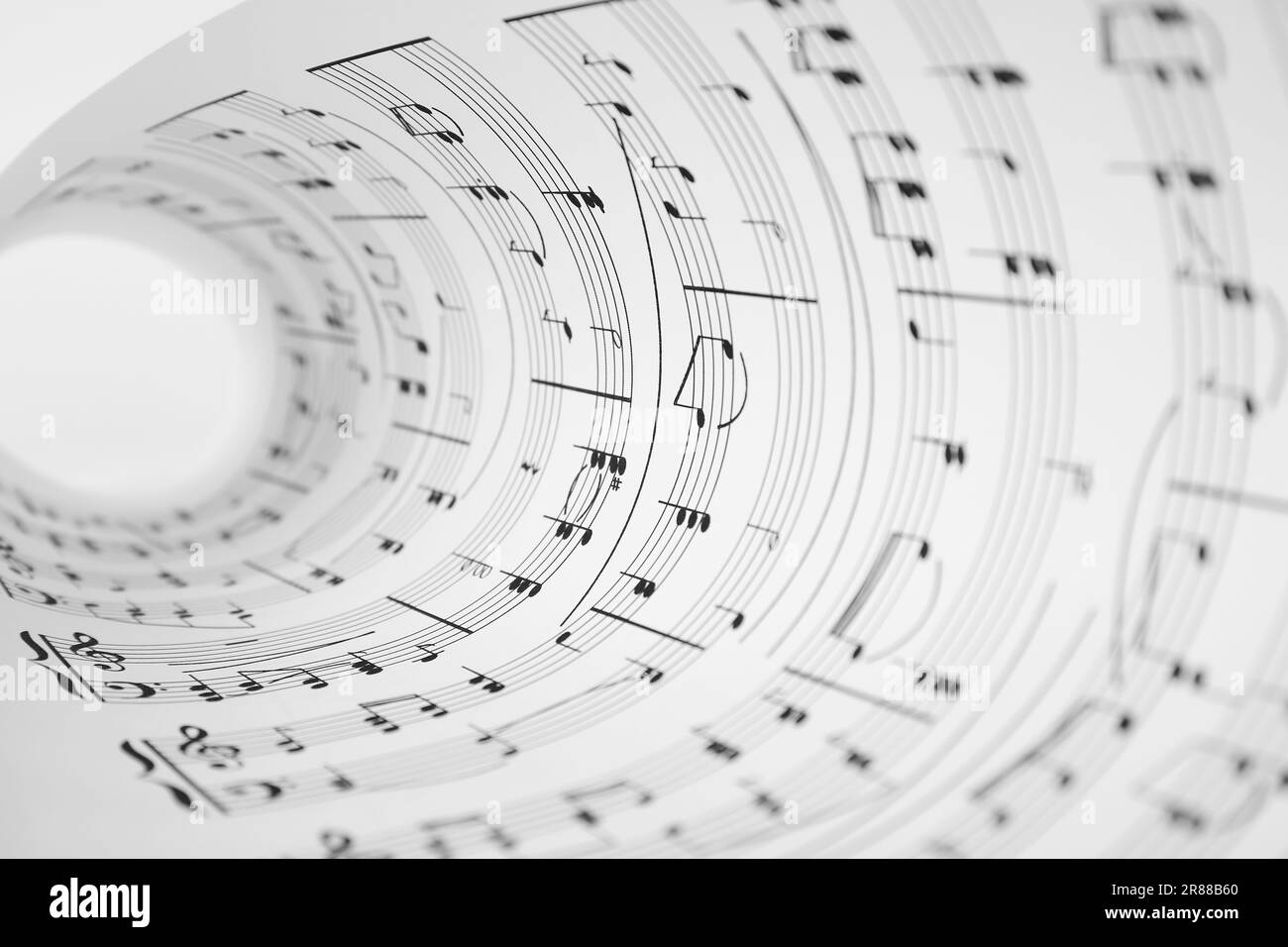 Rolled sheet with music notes on white background, closeup view Stock ...