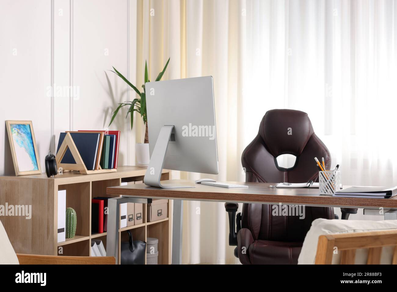 Receptionist workplace with computer and waiting area. Interior design ...