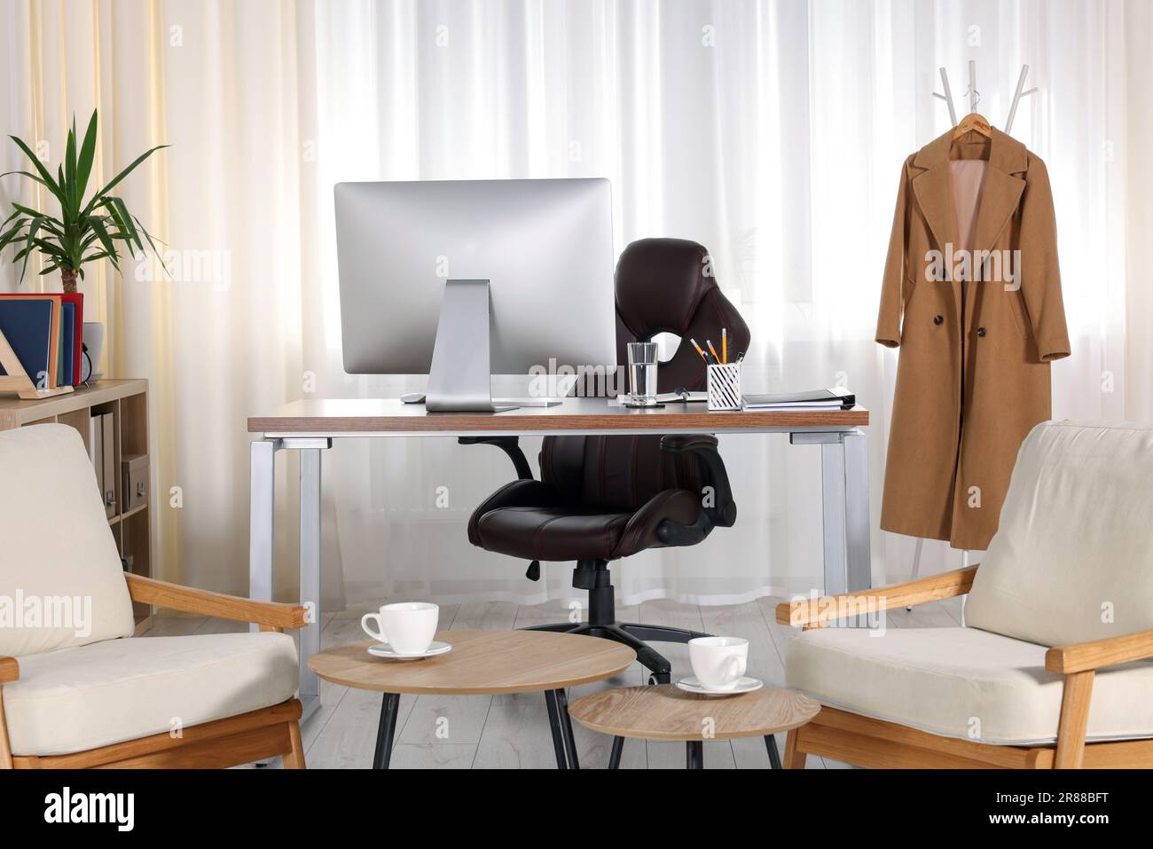 Receptionist workplace with computer and waiting area. Interior design ...