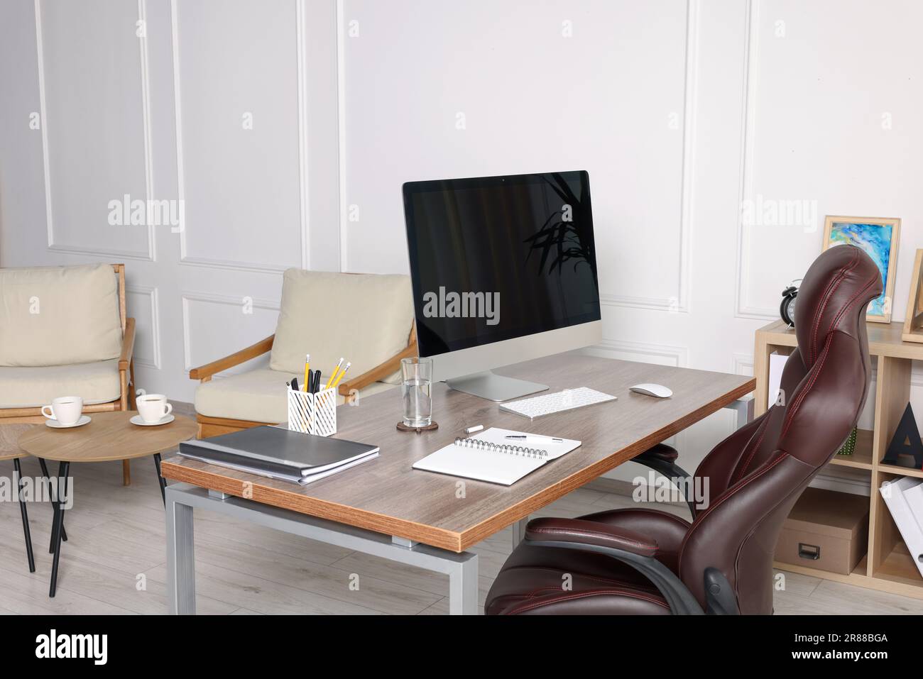 Receptionist workplace with computer and waiting area. Interior design ...