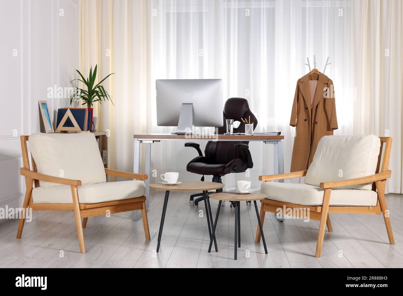 Receptionist workplace with computer and waiting area. Interior design ...