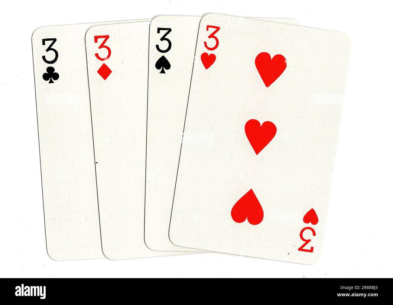 A fan of vintage playing cards featuring threes on a white background ...
