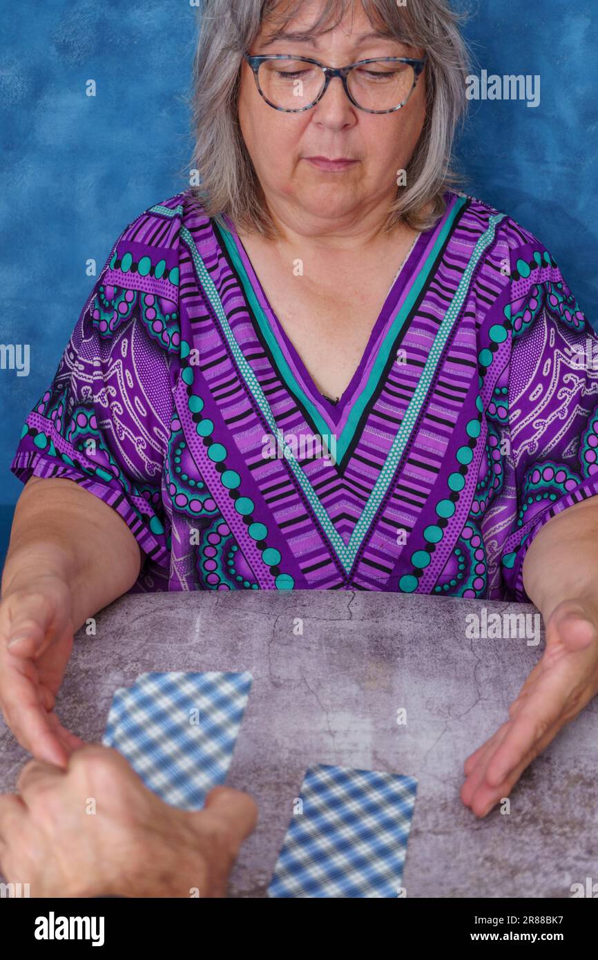 Man's hand cutting the tarot cards, facing the fortune teller Stock ...