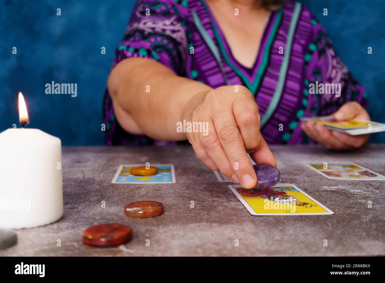 Woman casting tarot cards hi-res stock photography and images - Alamy