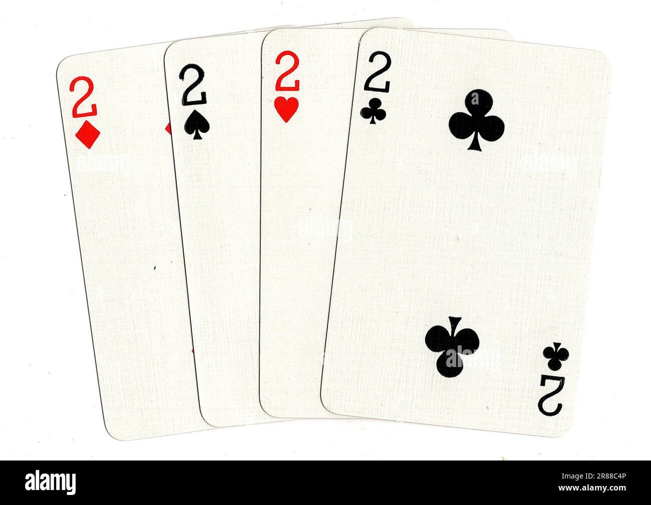 A fan of vintage playing cards featuring twos on a white background ...