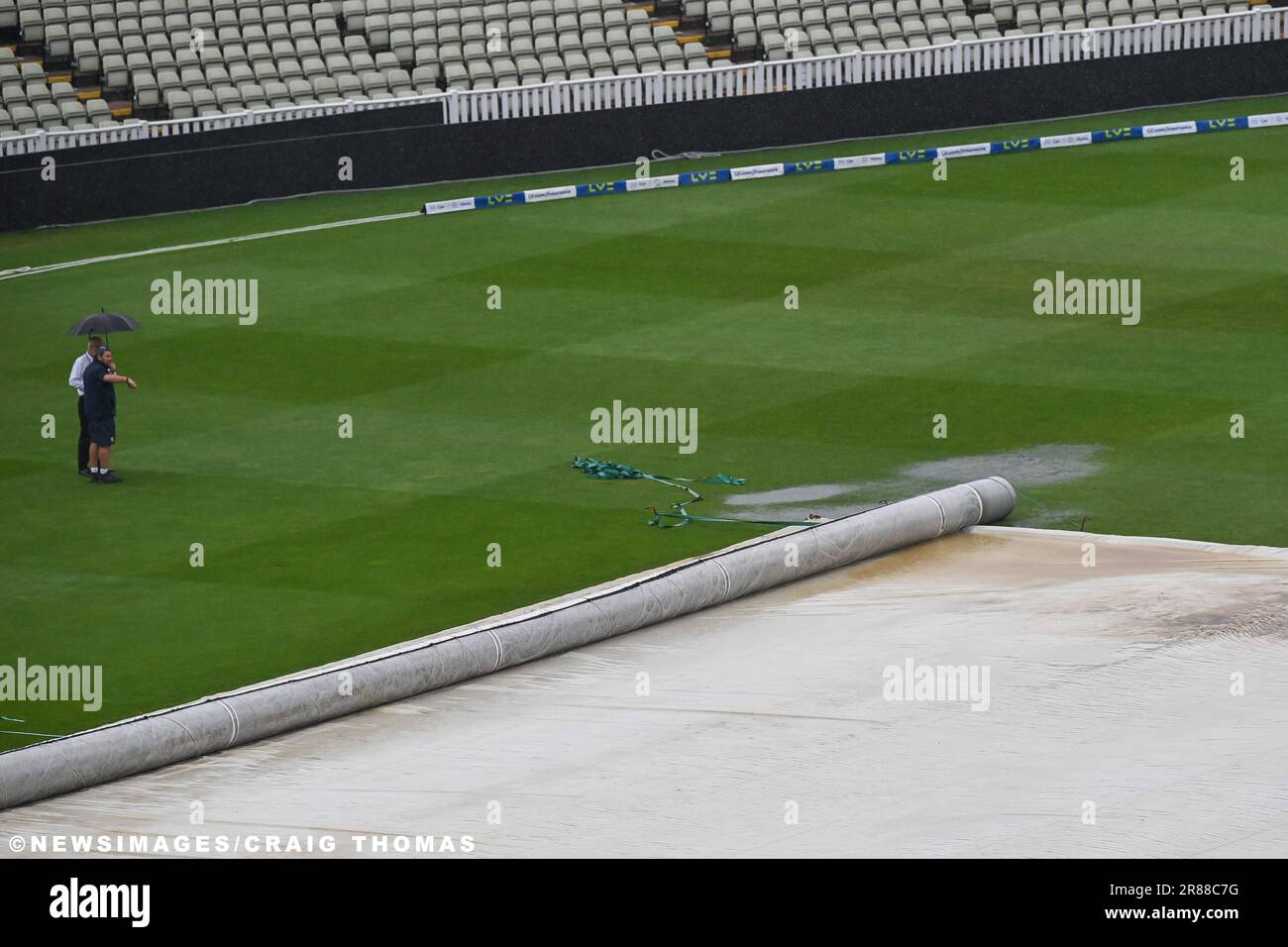 A general view of Edgbaston as heavy rain falls and pools of water on ...