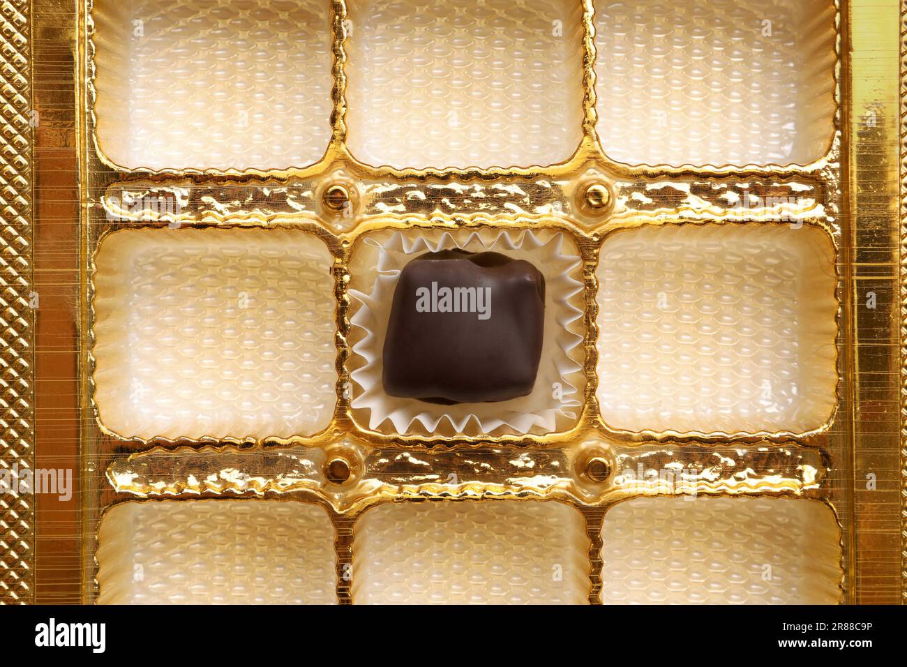 Partially empty box of chocolate candies as background, top view Stock ...