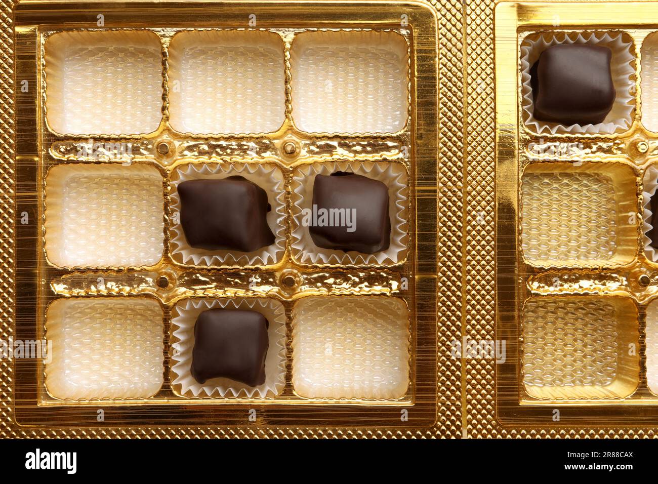 Partially empty box of chocolate candies as background, top view Stock ...