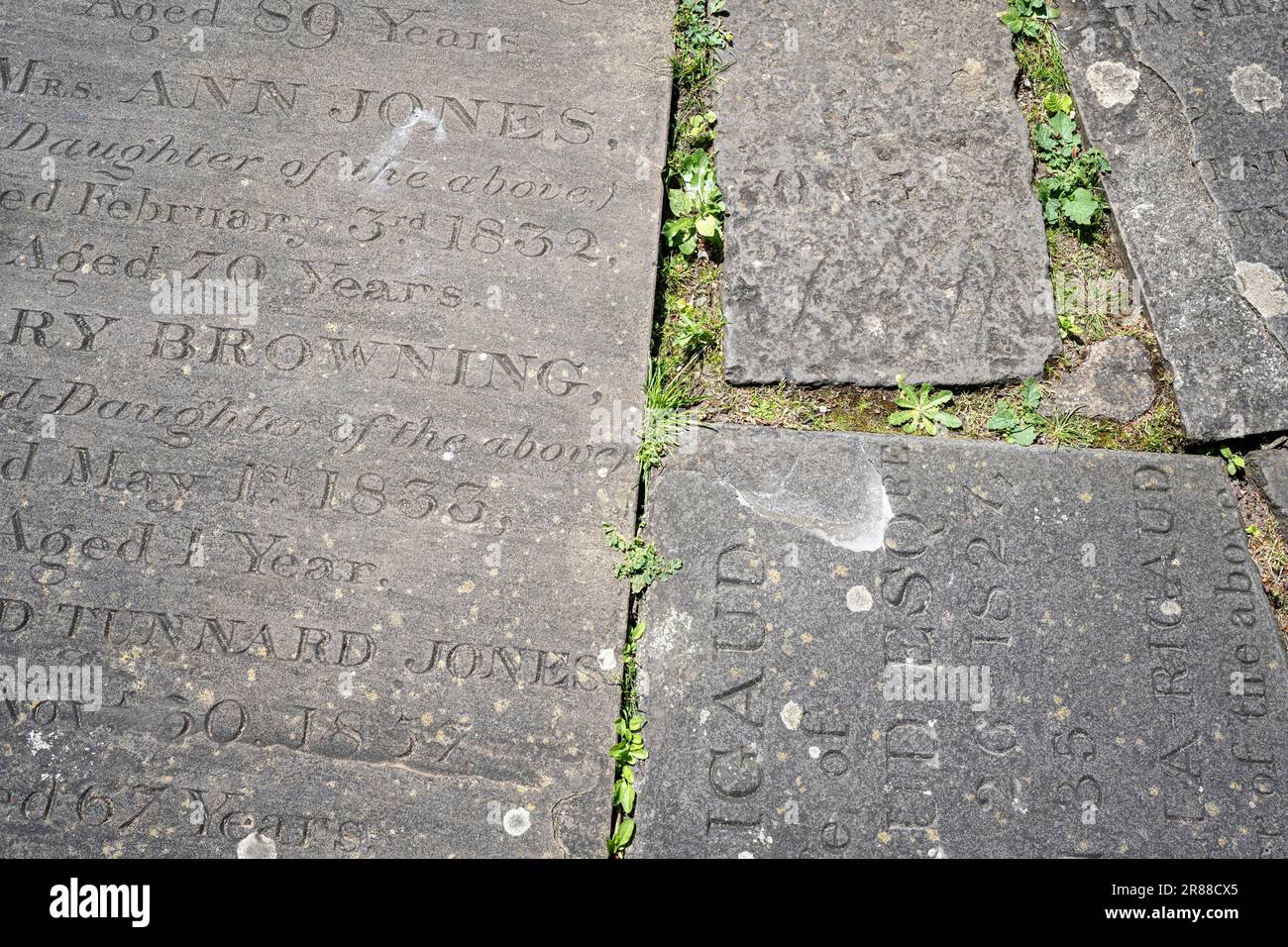 Old gravestones with inscriptions are used as stepping stones Stock ...