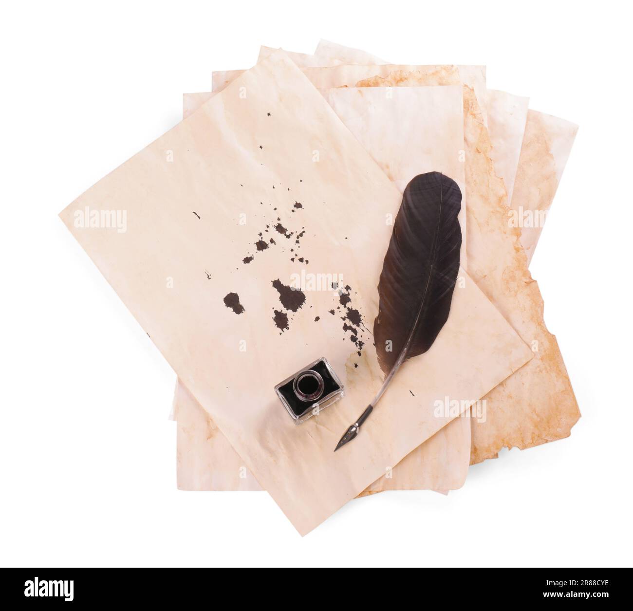 Parchment with stains of ink, feather pen and inkwell on white ...