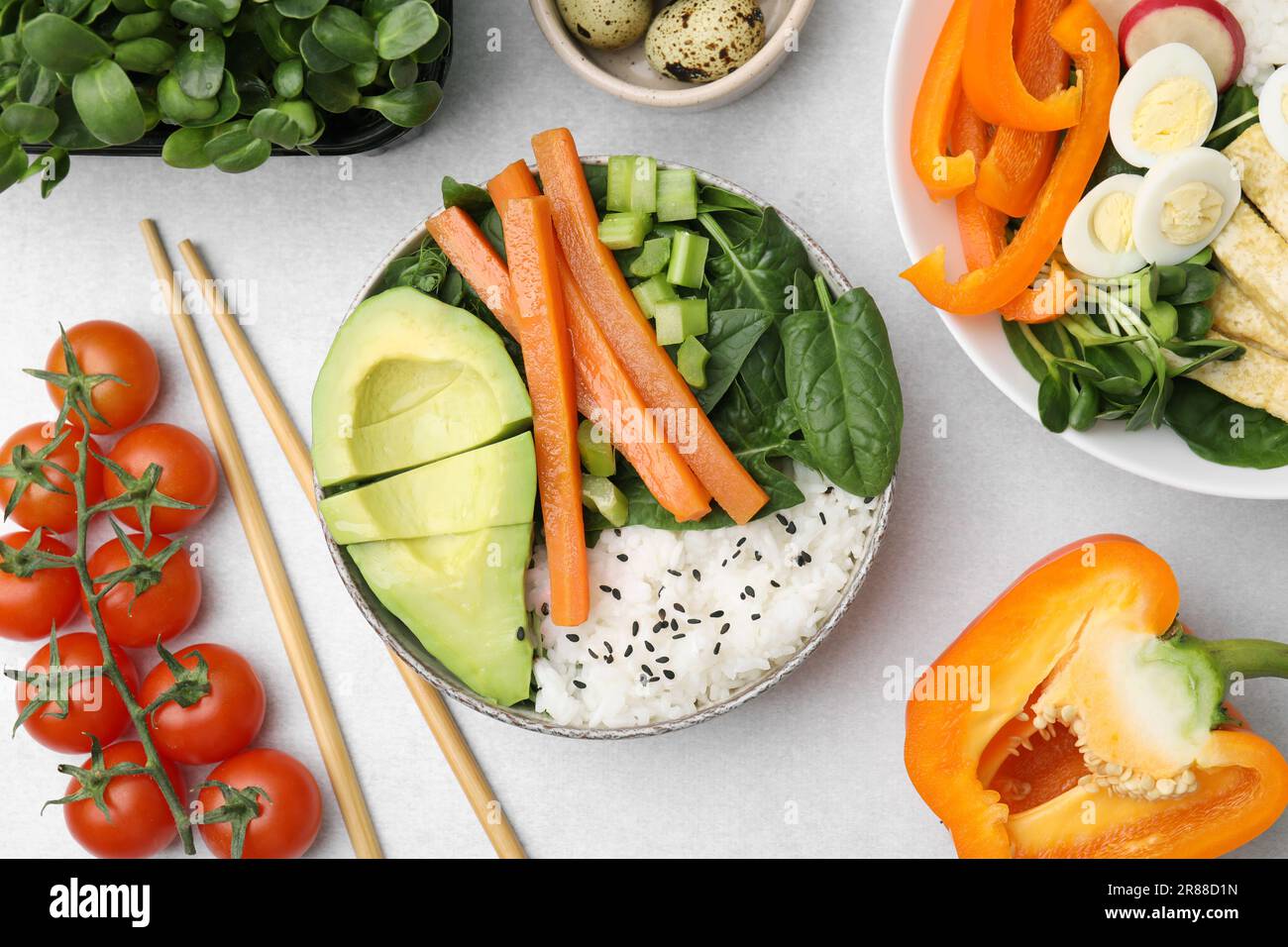 Delicious poke bowl and ingredients on light grey background, flat lay ...