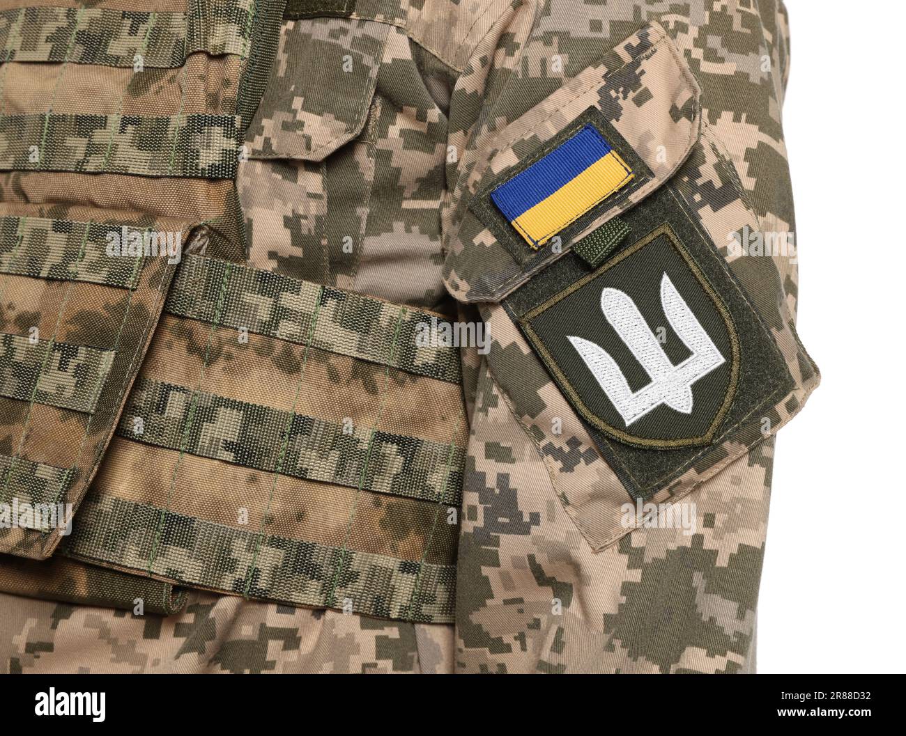 Soldier with Ukrainian flag and trident on military uniform against ...