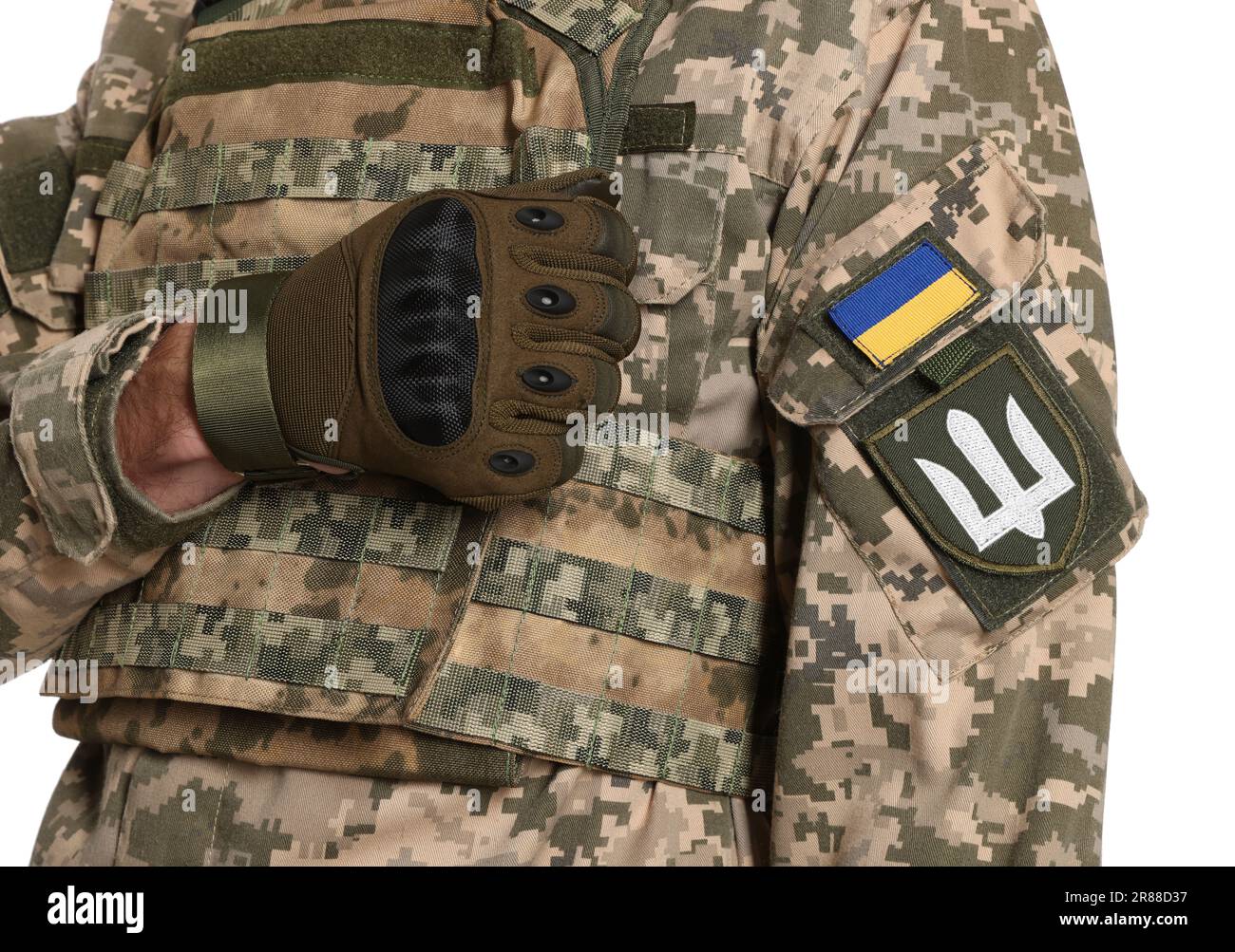 Soldier with Ukrainian flag and trident on military uniform against ...