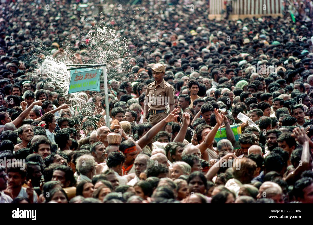 Sprinkling of Brahmma theertham (sacrad water) to the people during ...