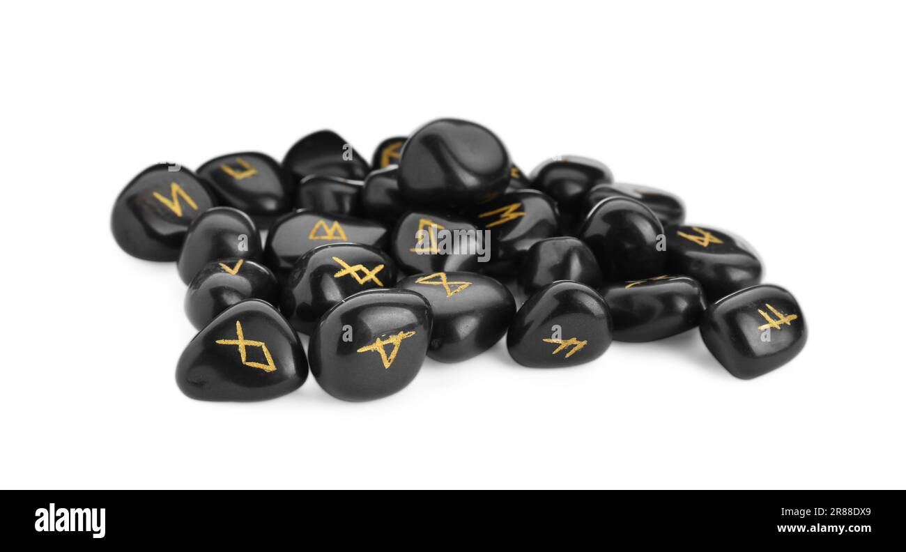Pile of black rune stones isolated on white Stock Photo - Alamy