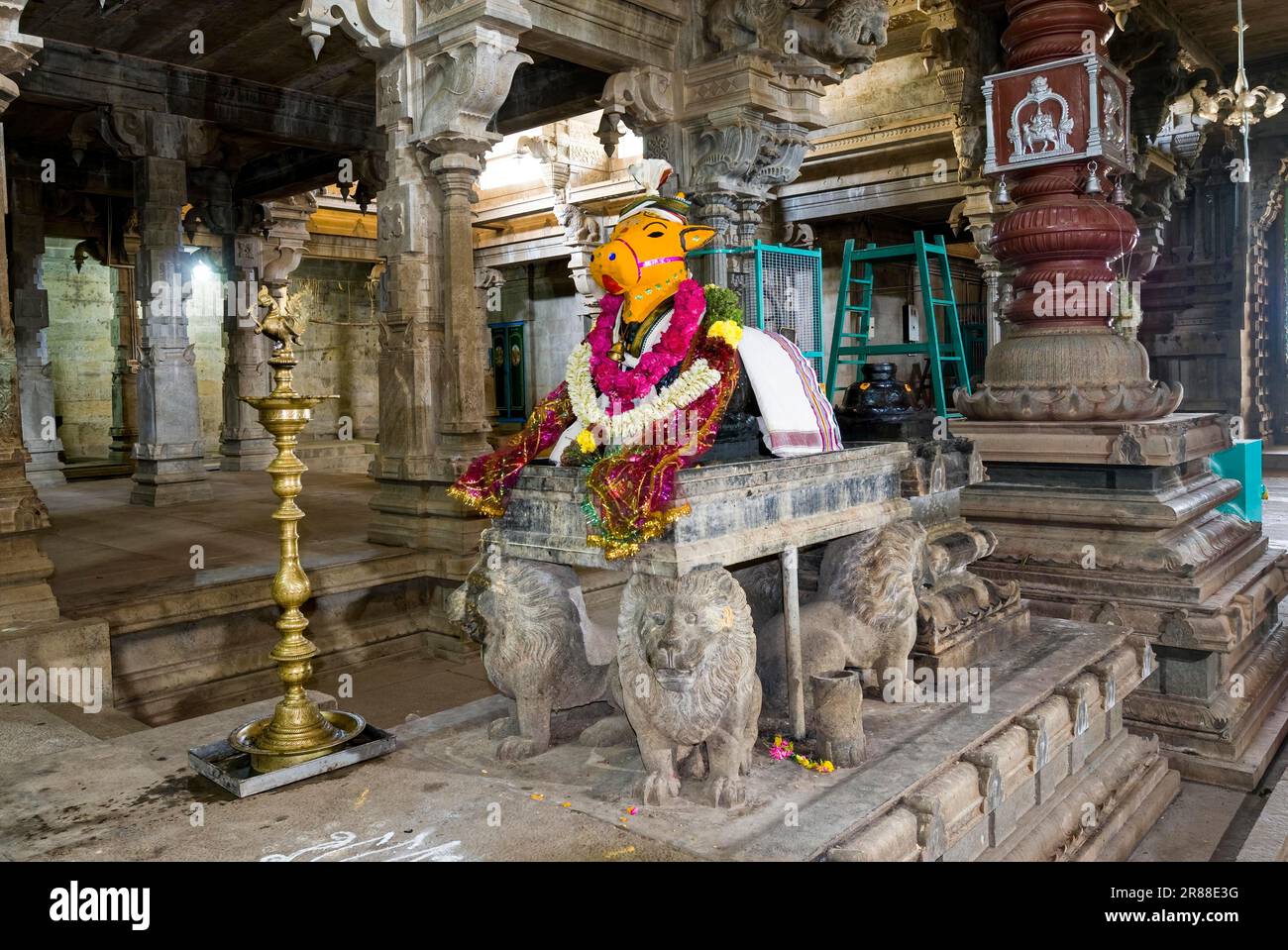 Decorated Nandhi positioned on top of four lion headed pillars at ...