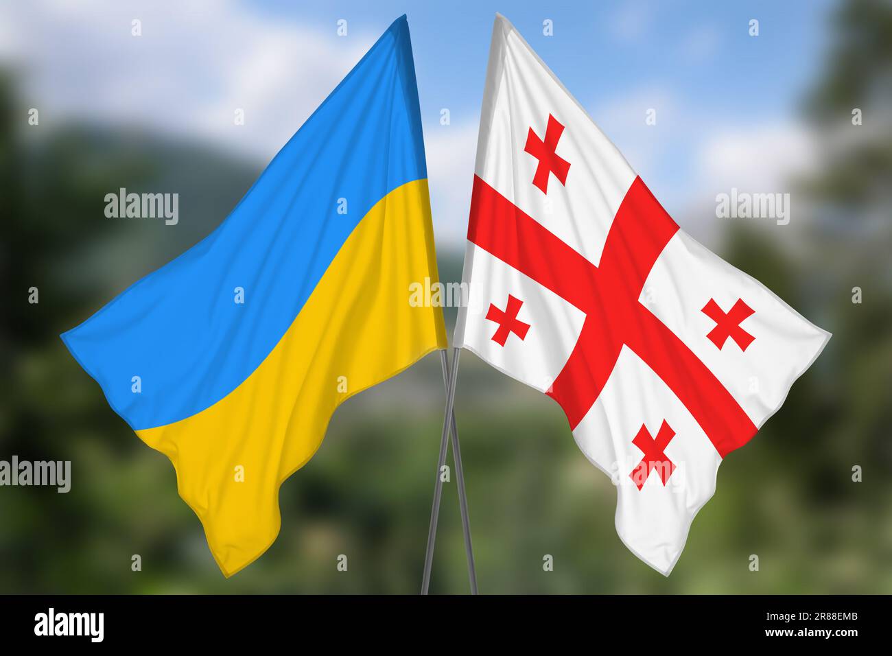 National flags of Ukraine and Georgia against blurred landscape Stock ...