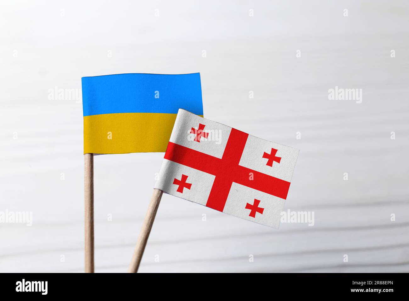 National flags of Ukraine and Georgia on white blurred background Stock ...