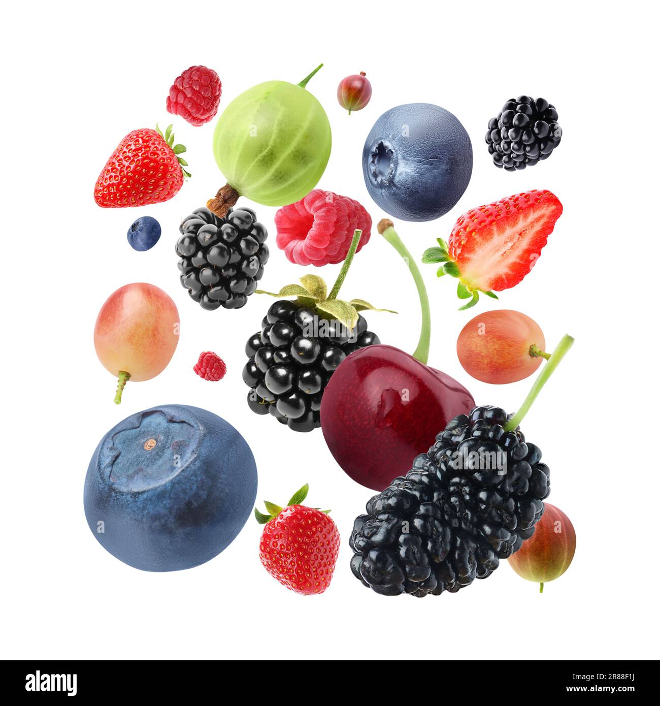 Many different fresh berries falling on white background Stock Photo ...